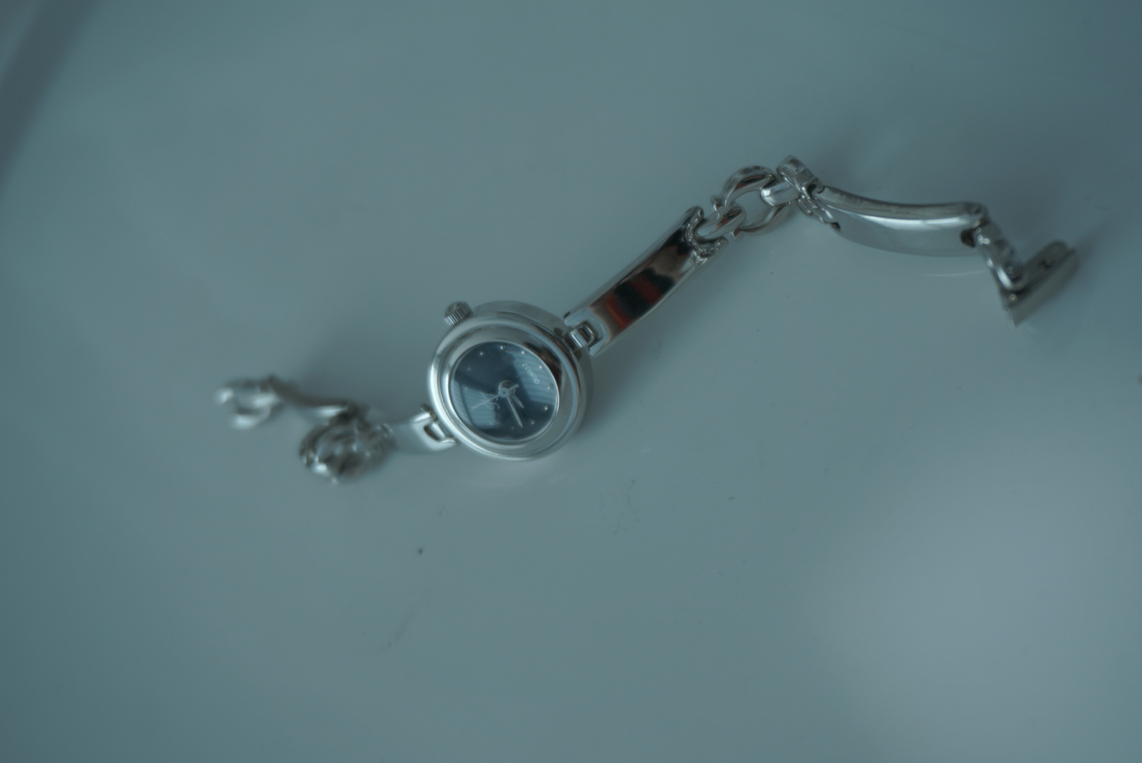 Blue convex JJ watch